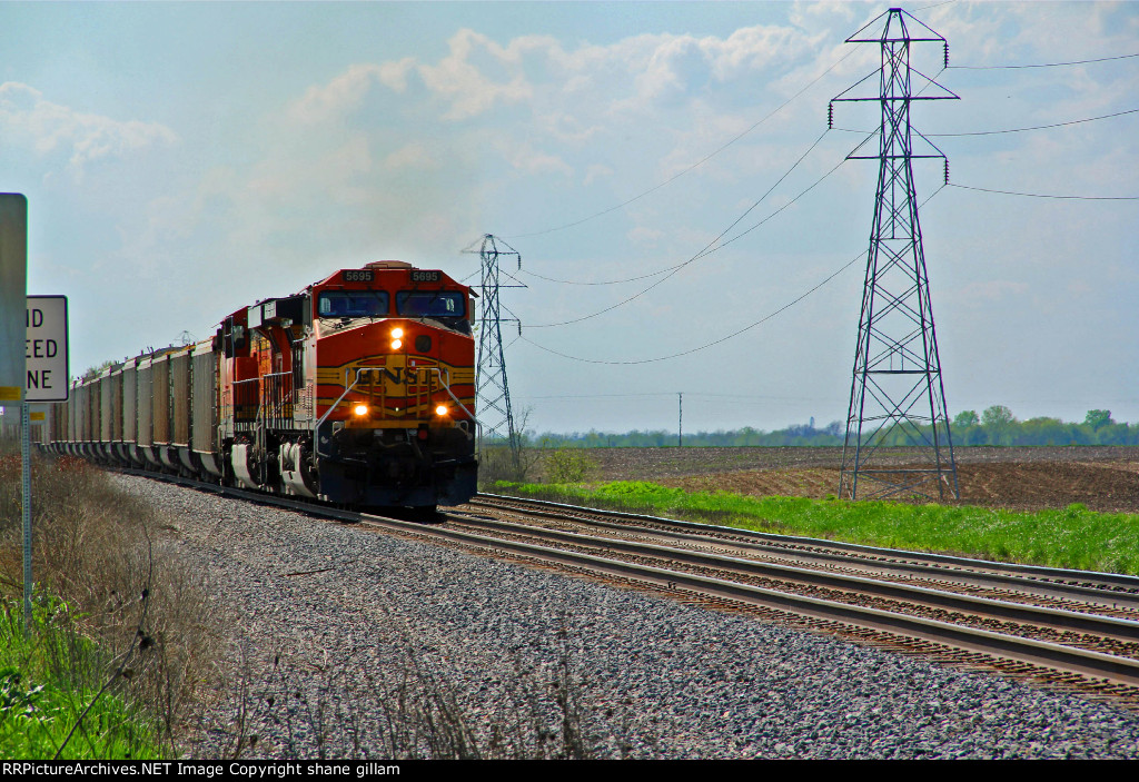 BNSF 5695 Takes a grain train EB,
